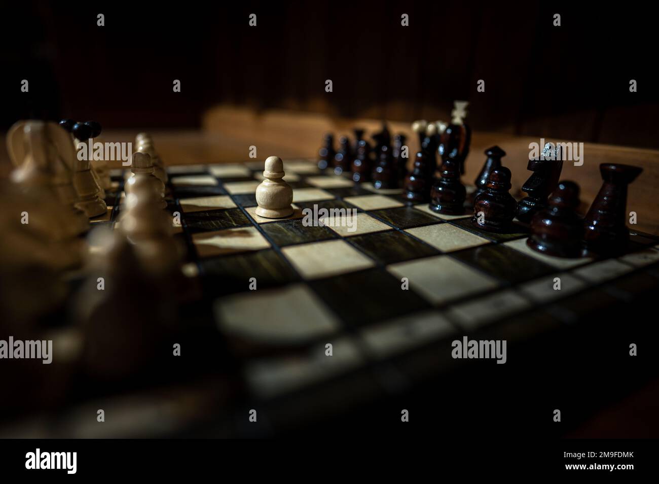 Blurred background with a low depth of focus. The set of wooden chess ...