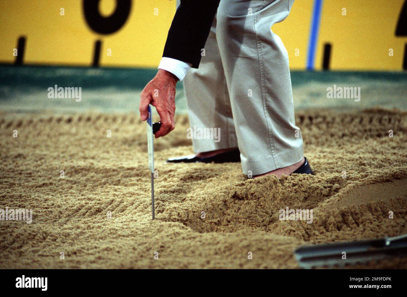 Straight on, medium shot from only the knees down as a judge marks the ...