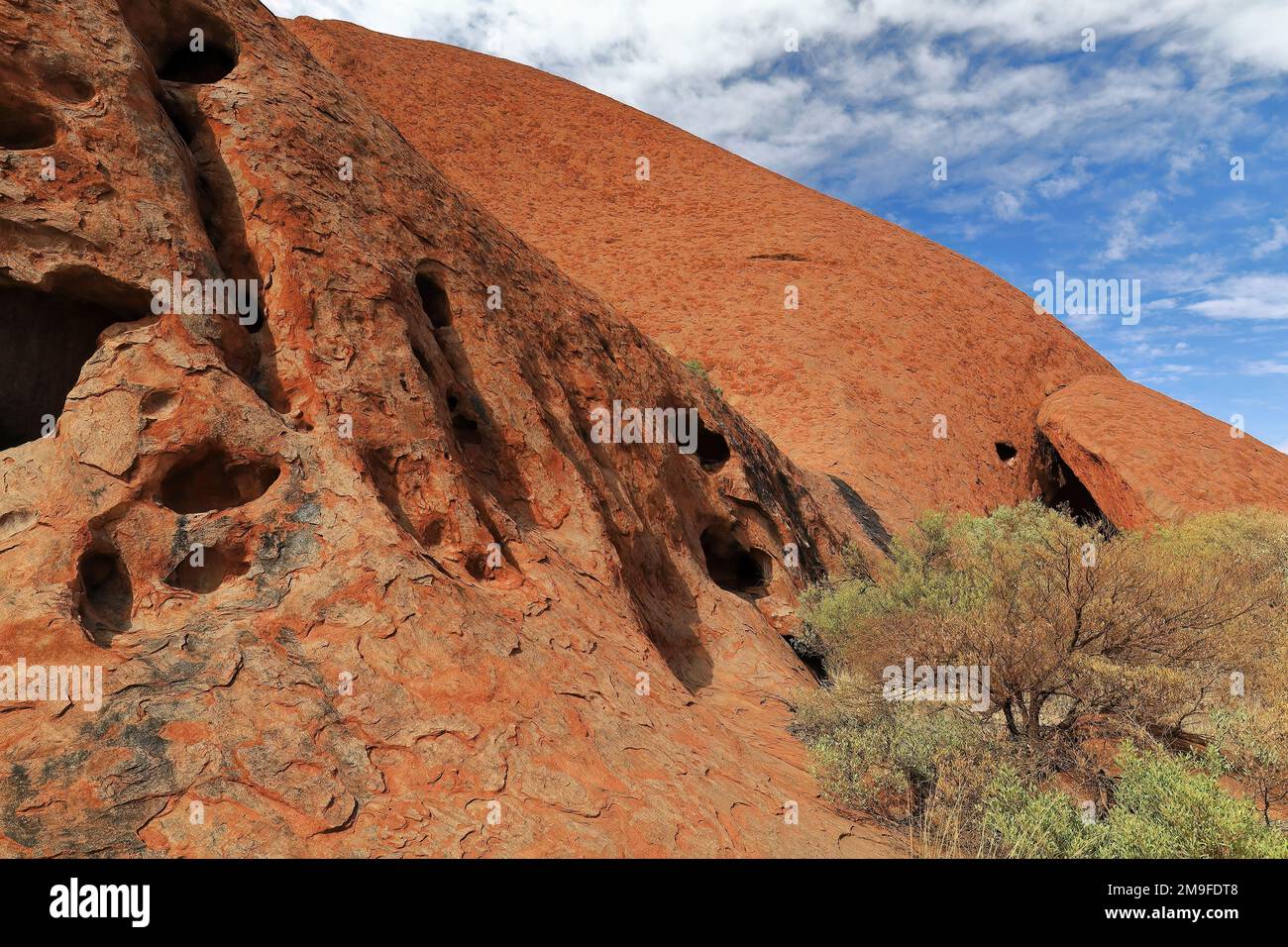 419 Hole-caves at the foot of Uluru-Ayers Rock seen from the base walk ...