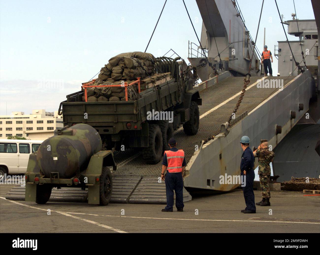 1ST Battalion, 3rd Marines, load their vehicles aboard the USS ...