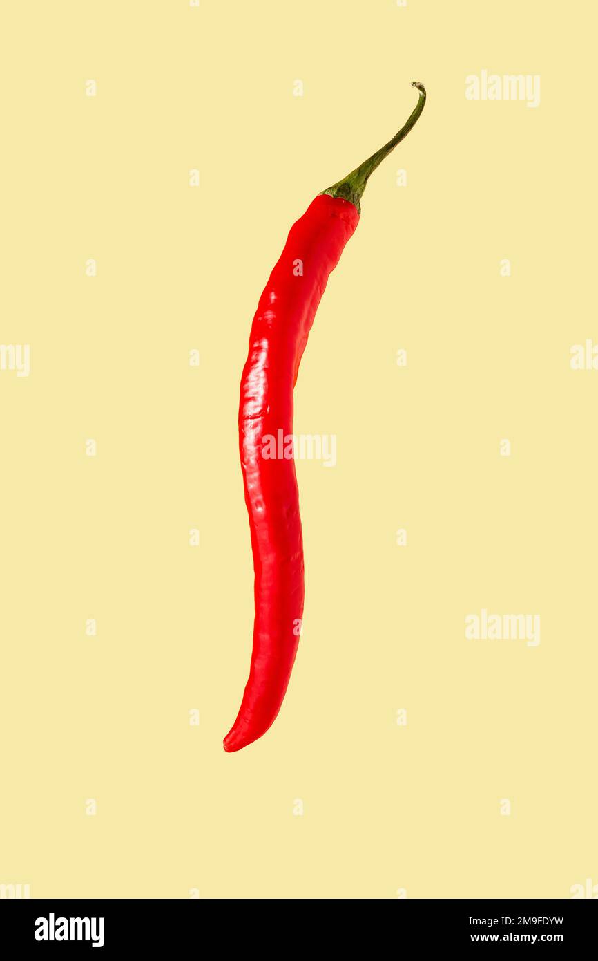 Chilli pepper isolated on beige background. Clipping path. Full depth ...