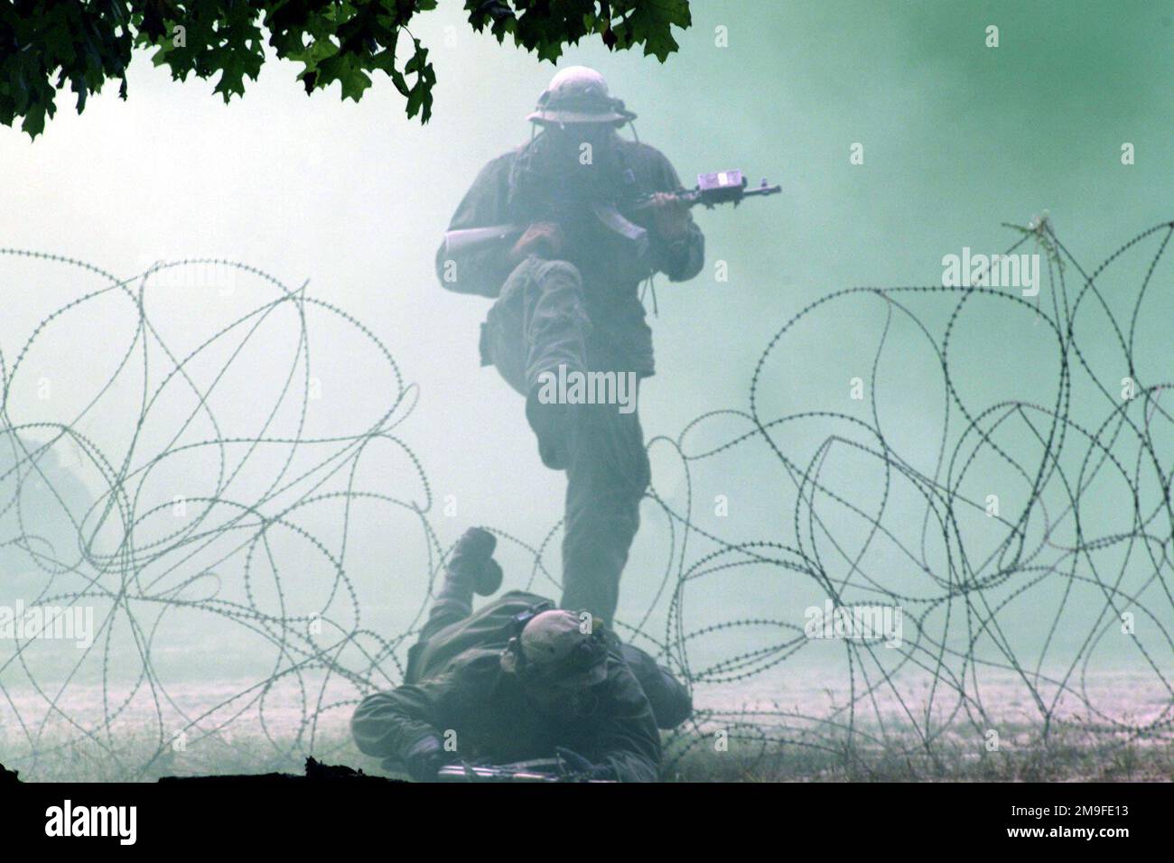Two students from the Opposing Forces (OPFOR) team demonstrate a method ...