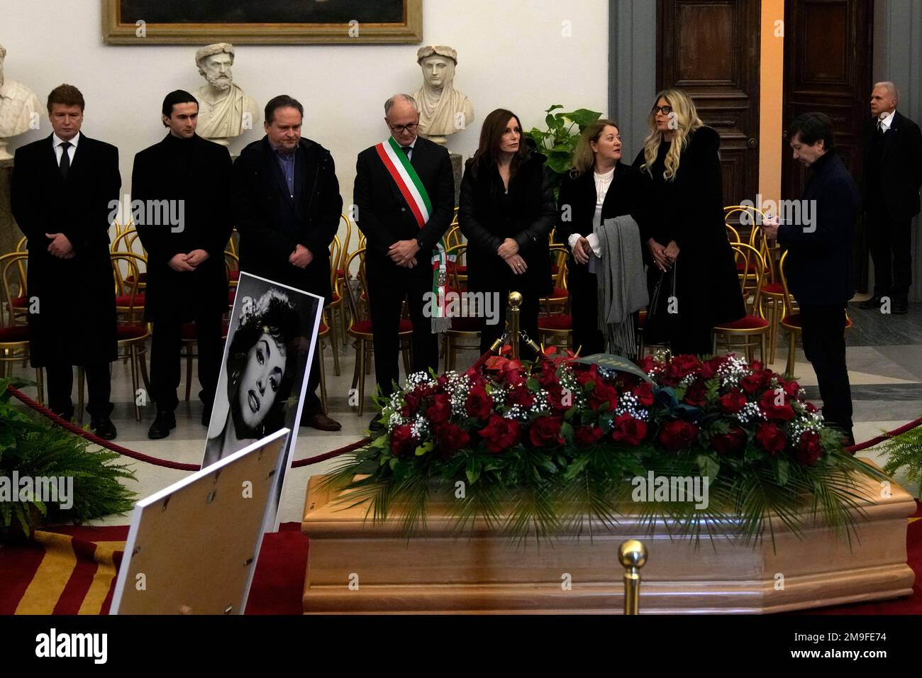 Rome's mayor Roberto Gualtieri, center, stands with relatives and ...
