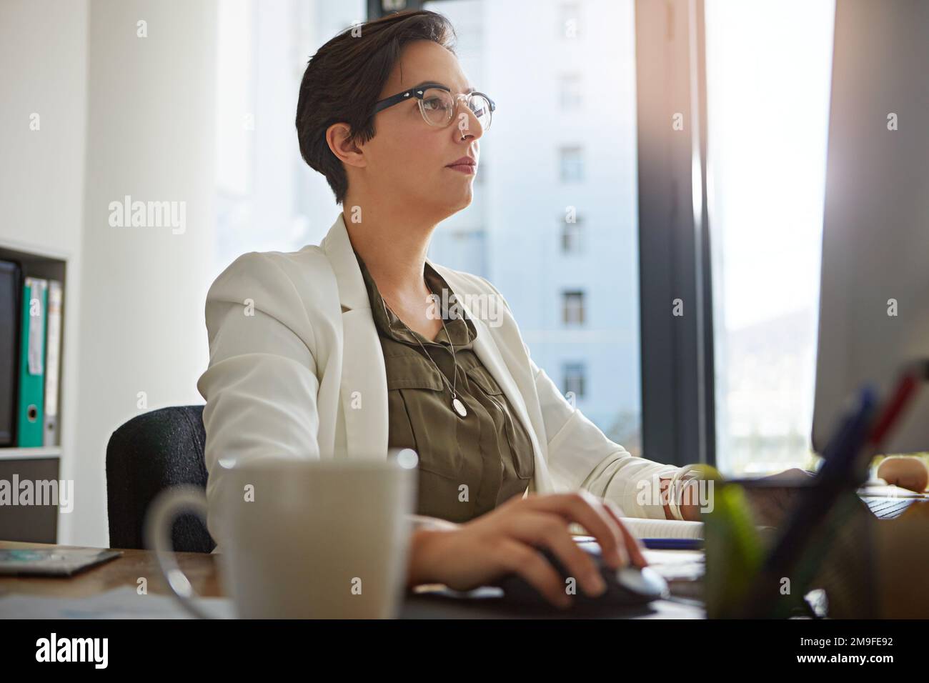Focus, office and business woman with computer typing online documents ...