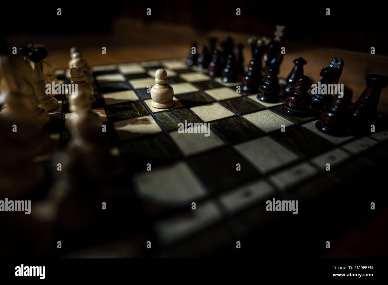 Blurred background with a low depth of focus. The set of wooden chess ...