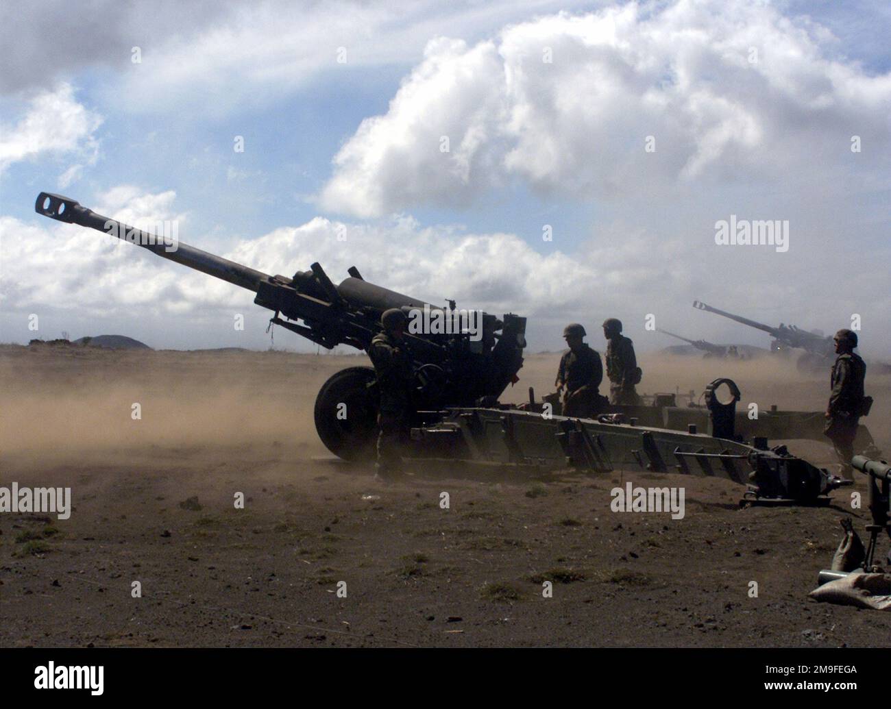 1ST Battalion, 12th Marines, Charlie Company, fires an M198 Howitzer ...