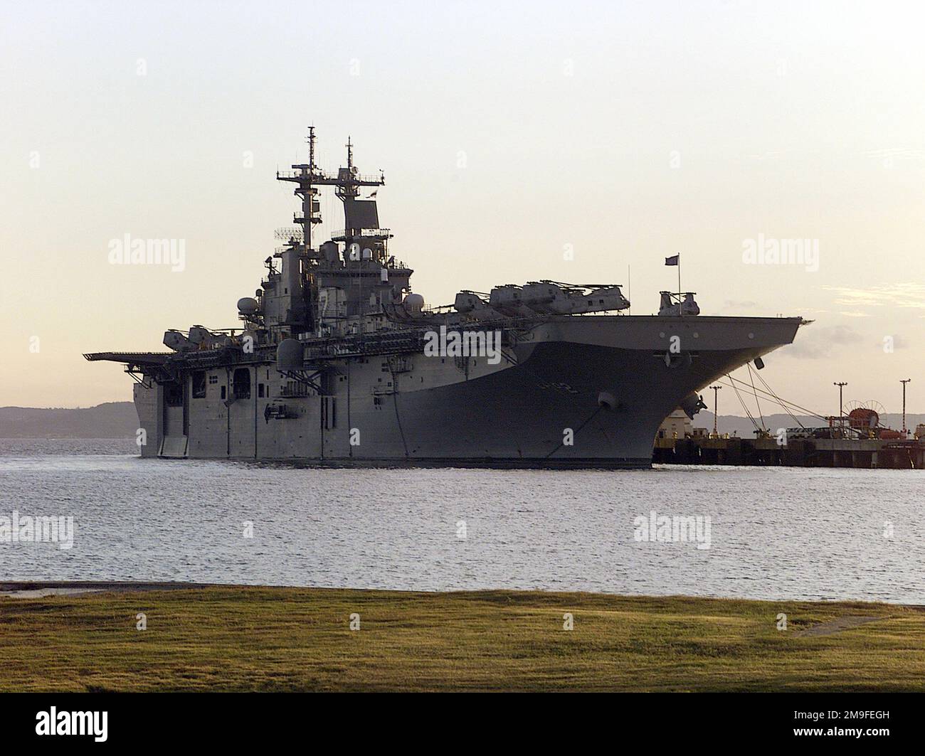 The USS Essex (LHD 2) sits docked at the White Beach port in Okinawa ...