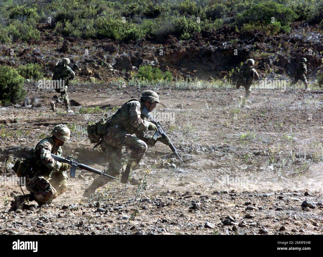 2nd Battalion, 3rd Marines, Echo Company, armed with M16 rifles, run ...
