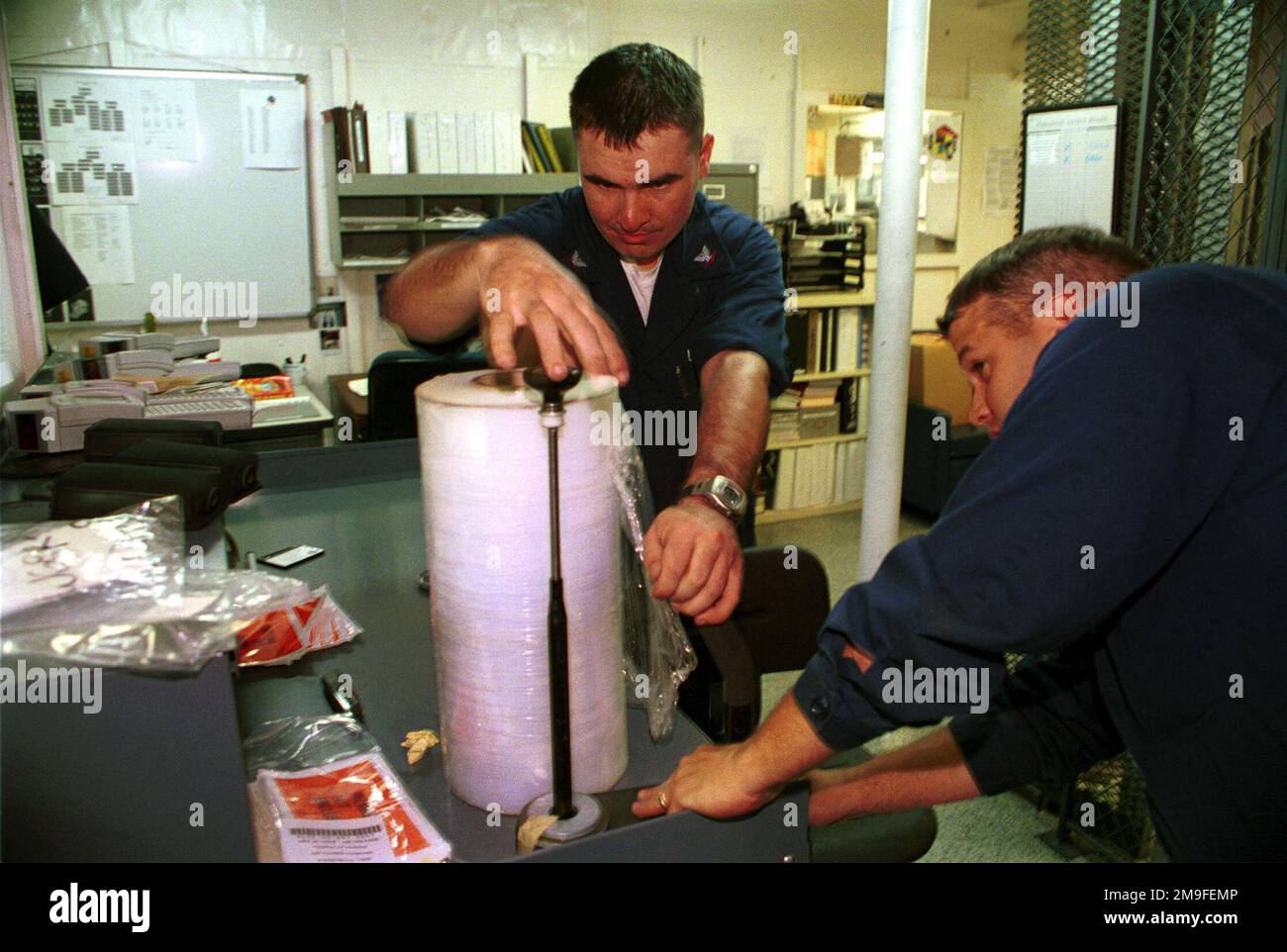 US Navy Storekeeper Second Class Jason Burmeister and US Navy ...