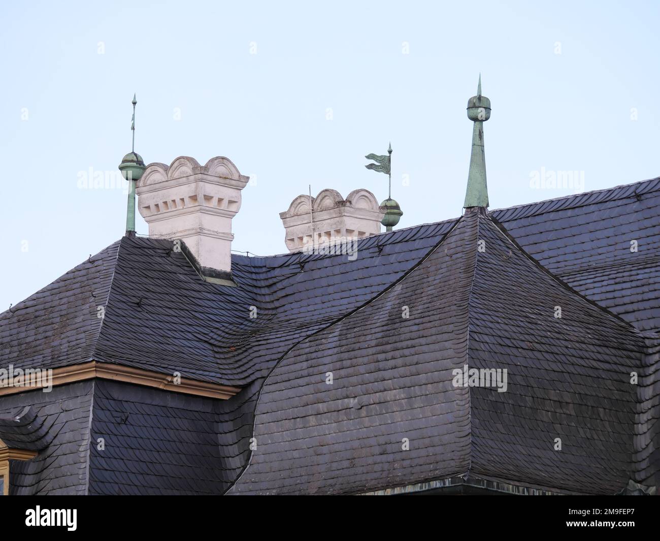 Baroque chimney on the roof of a castle with slate roof Stock Photo - Alamy