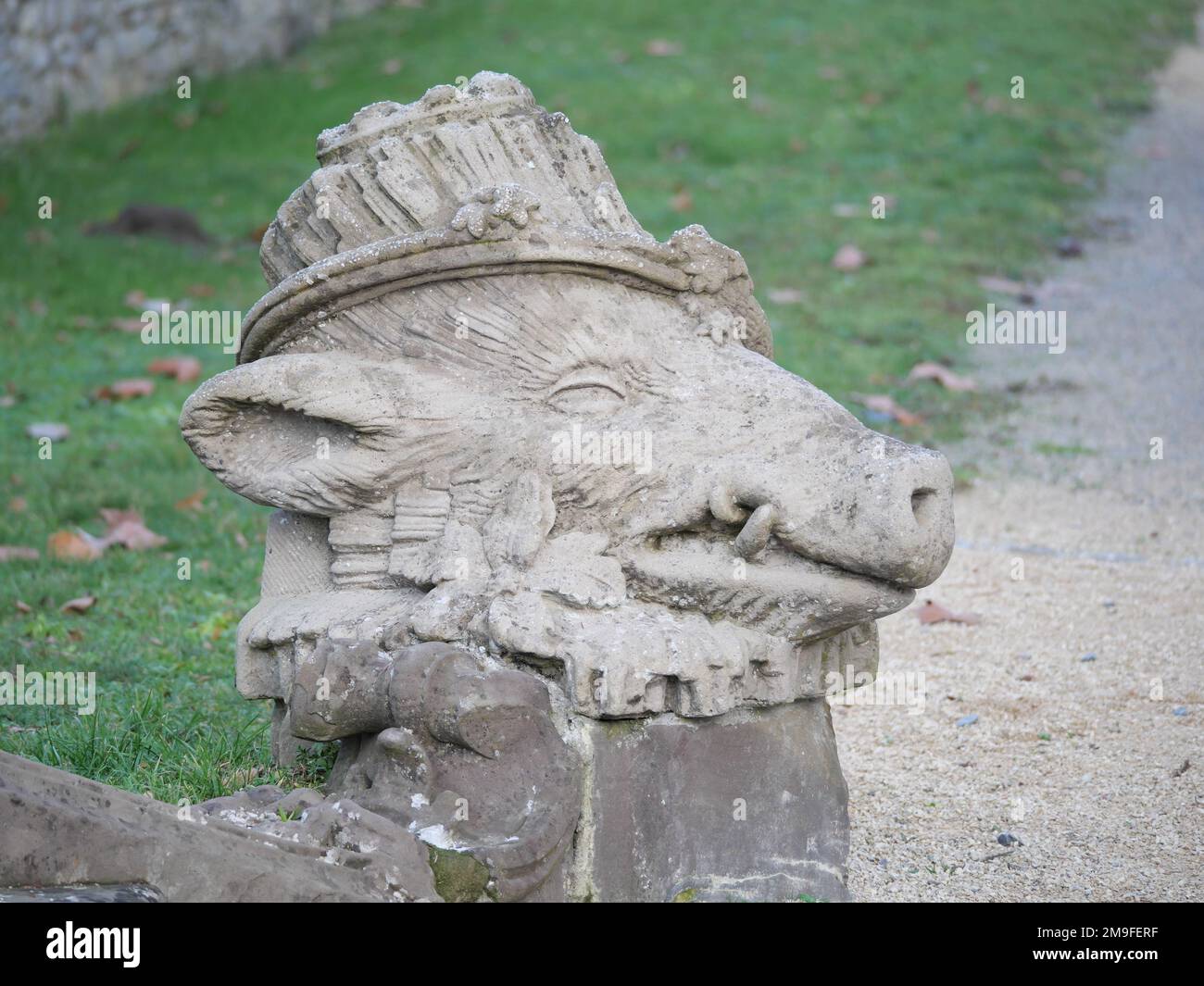 Baroque stone statue of a wild boar head in a palace park Stock Photo ...