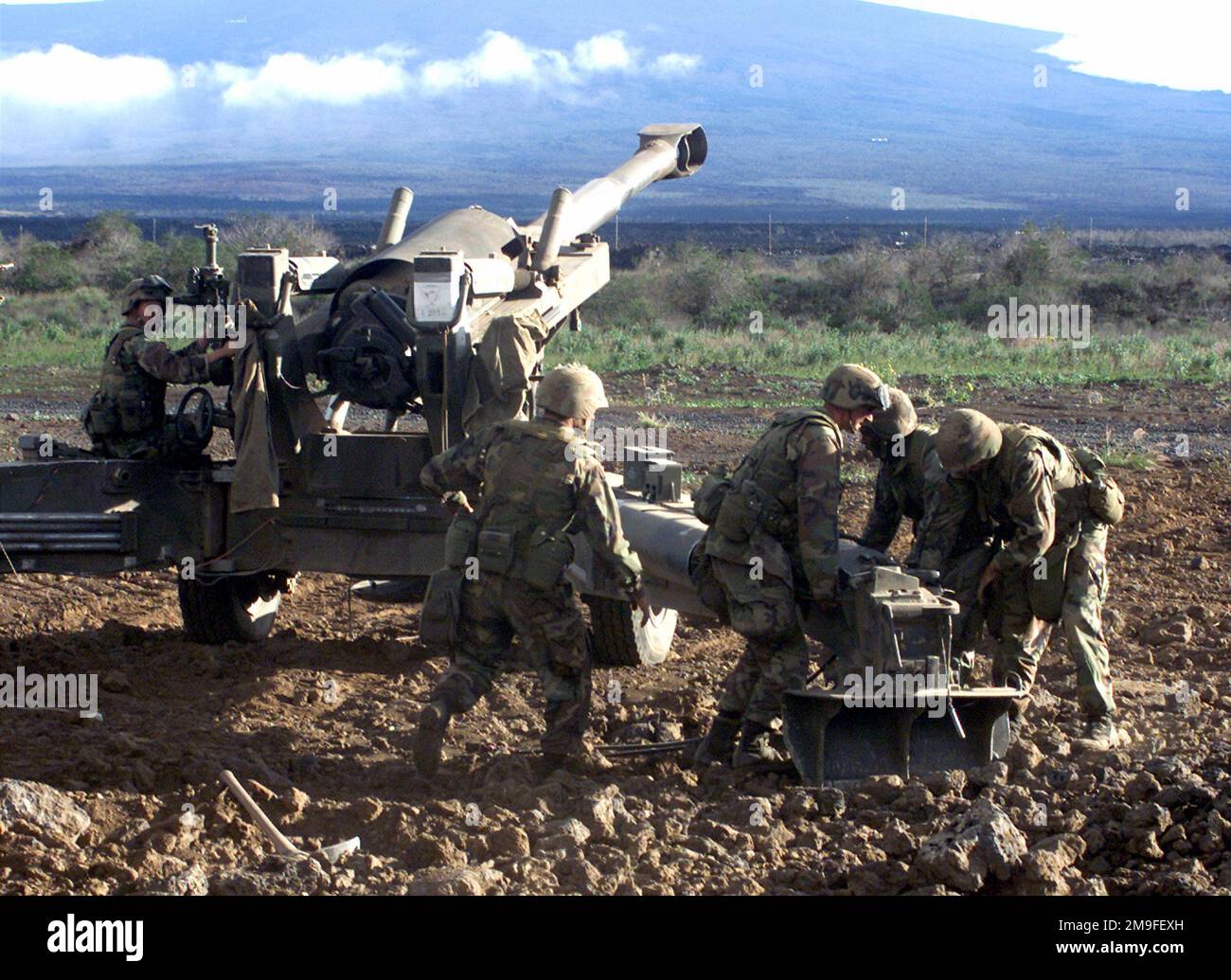 US Marines from 1ST Battalion, 12th Marines, Charlie Company, practice setting up an M198 ...