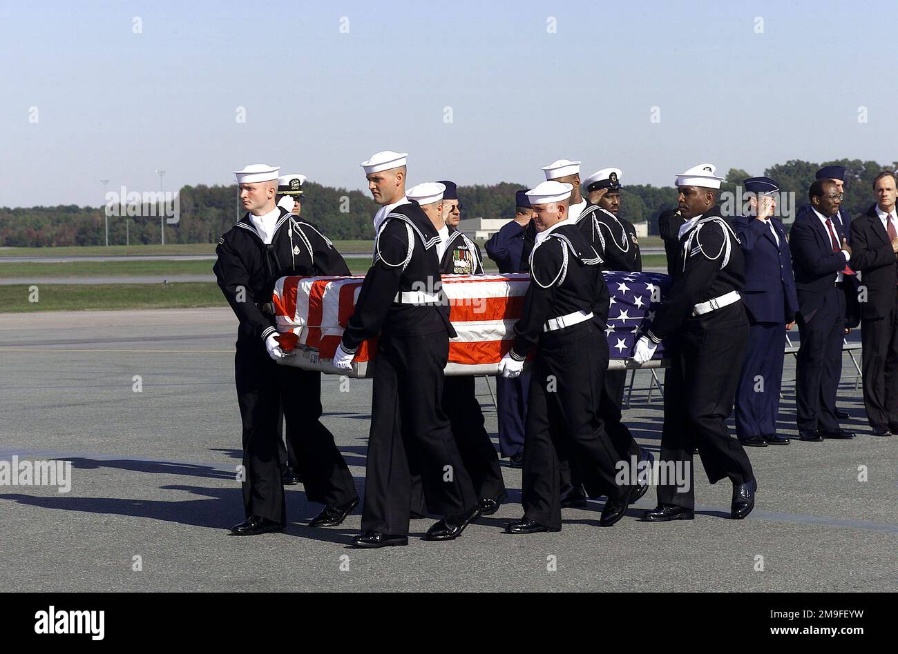 Members of the United States Navy Ceremonial Guard carry the casket of ...