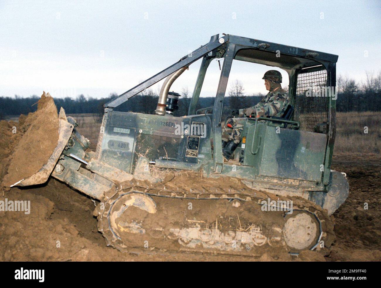 A soldier with a D5G bulldozer from the 426th Forward Support Battalion ...