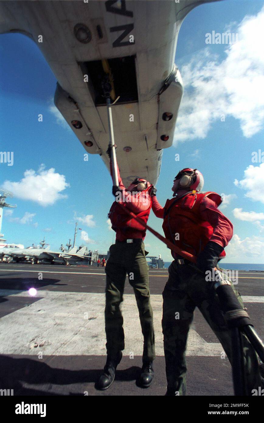 US Navy Aviation Ordnanceman Michael Tune has a firm grip on the ...