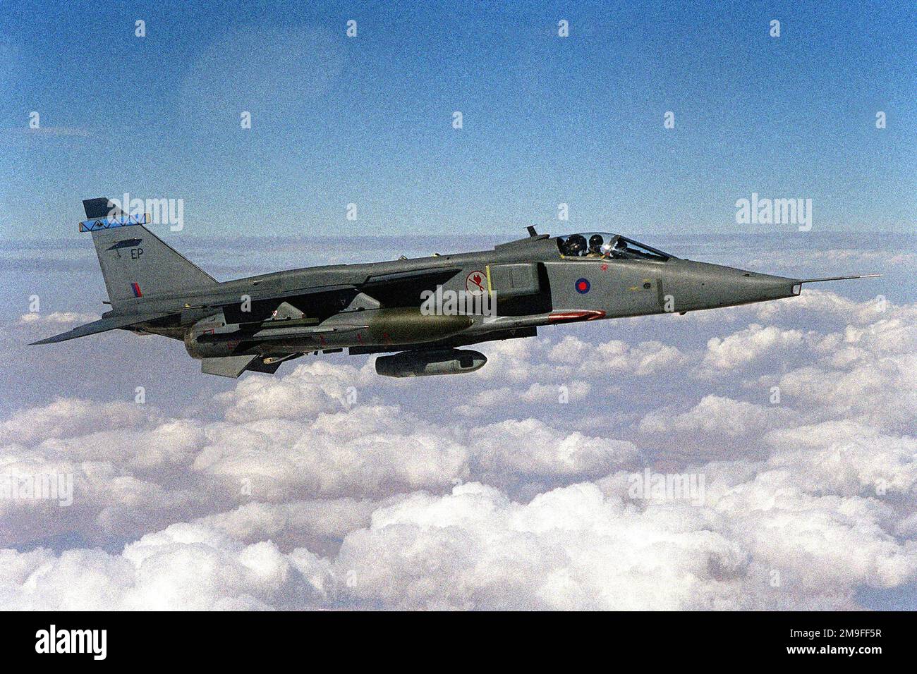 A British Royal Air Force Jaguar flies along side a RAF VC-10 Tanker ...