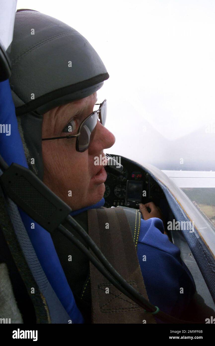 Lon B. Anderson looks over his shoulder during a flight near Shaw Air ...