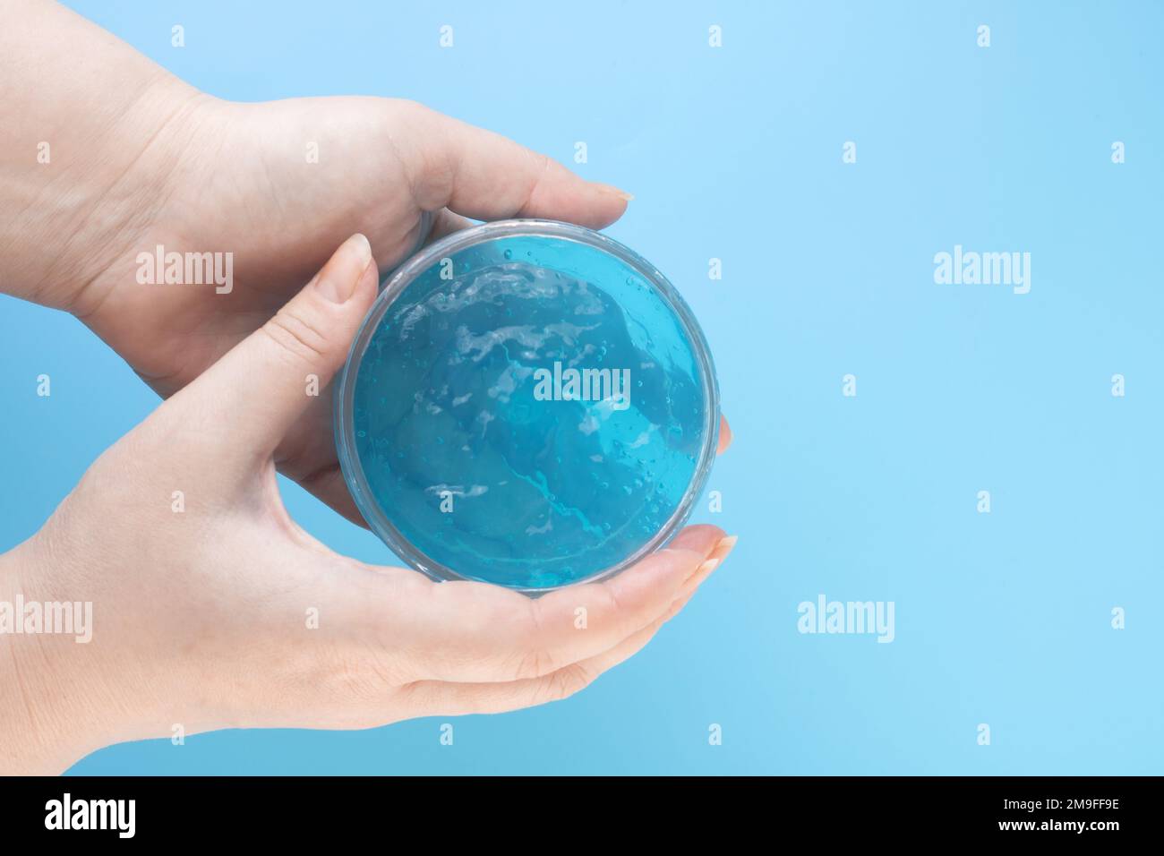 Liquid transparent gel for cleansing the face in a transparent jar in ...