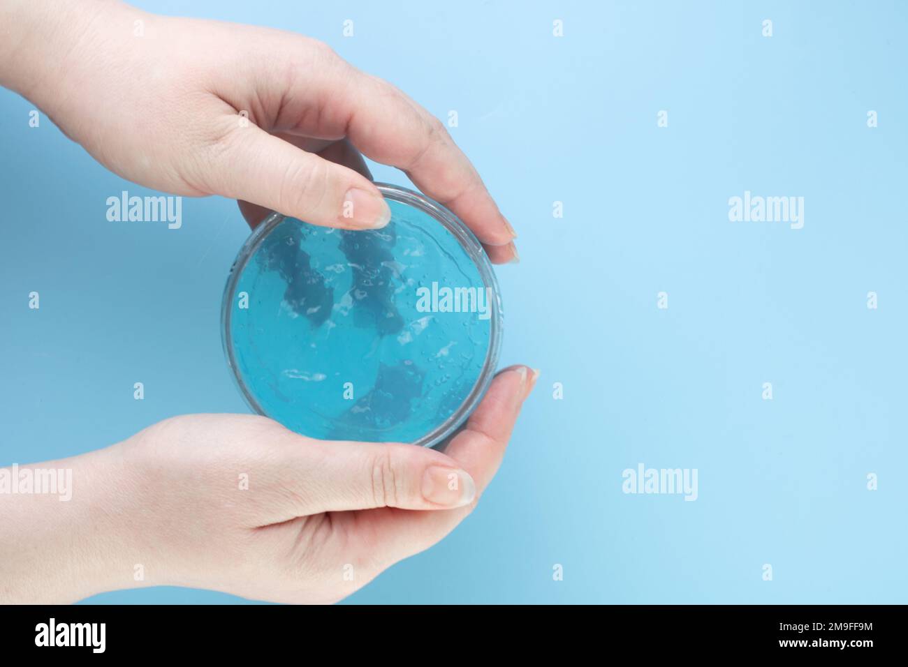 Liquid transparent gel for cleansing the face in a transparent jar in ...