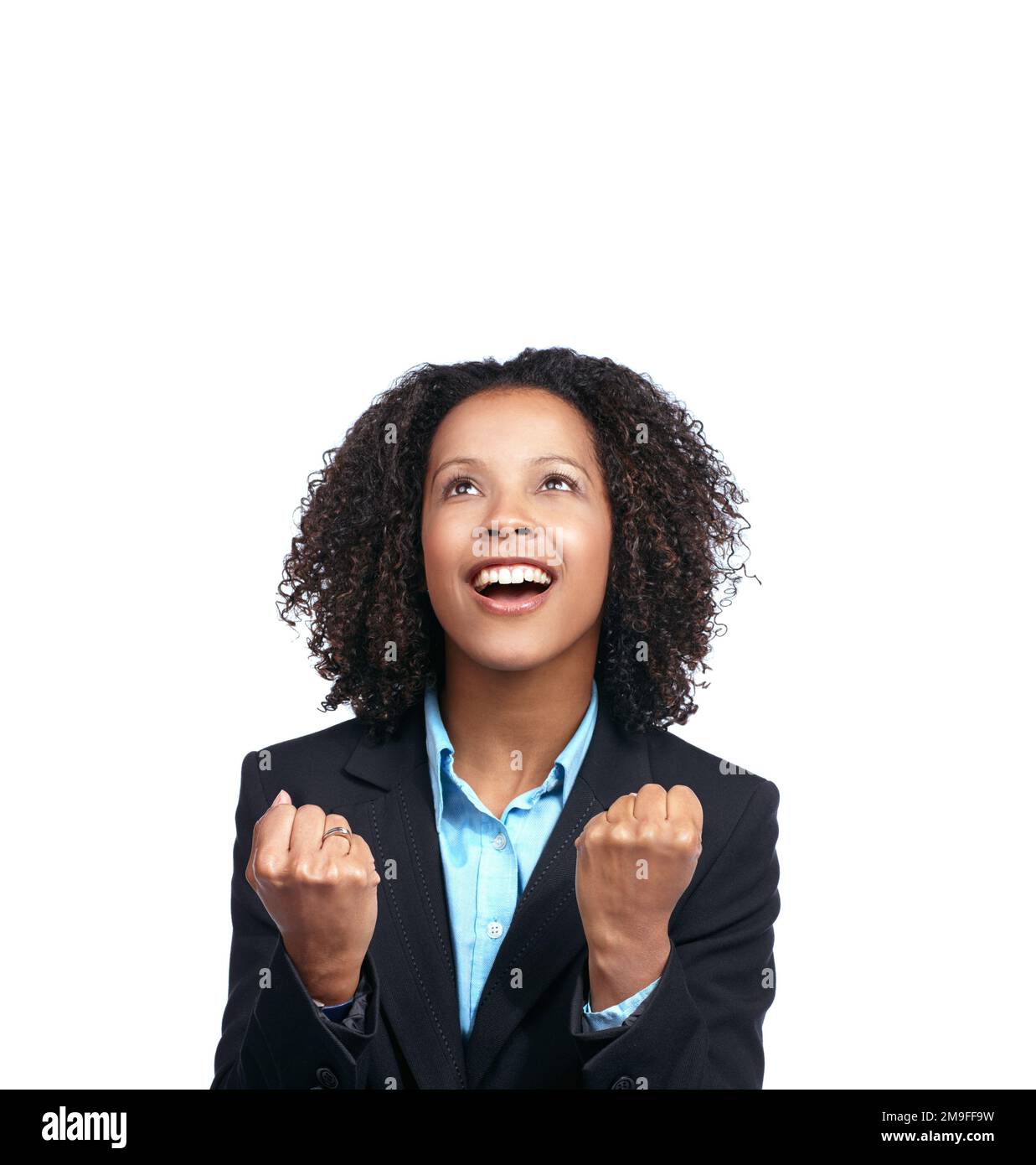 Fist, looking up and success woman isolated on white background winner ...
