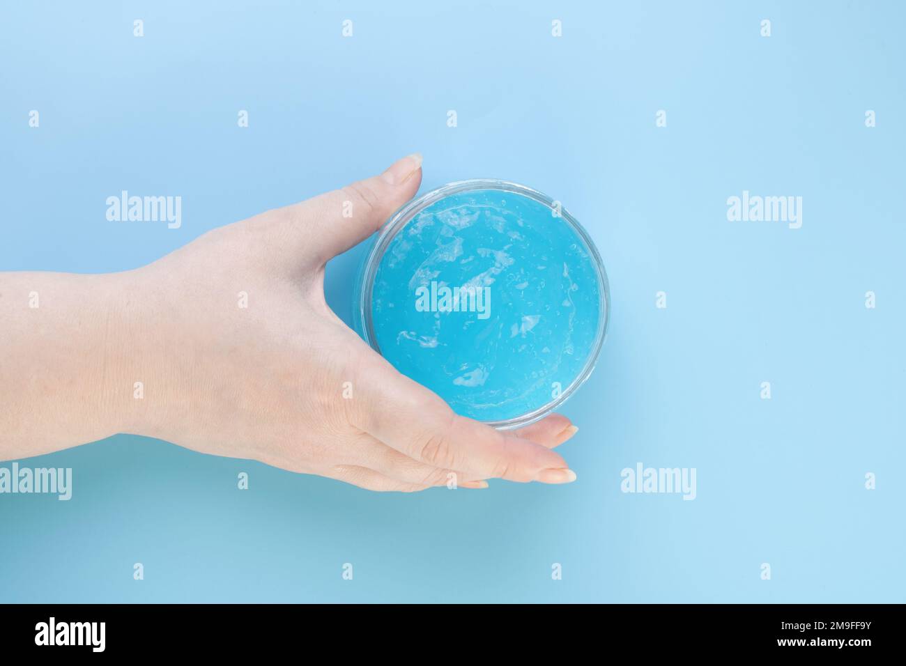 Liquid transparent gel for cleansing the face in a transparent jar in ...