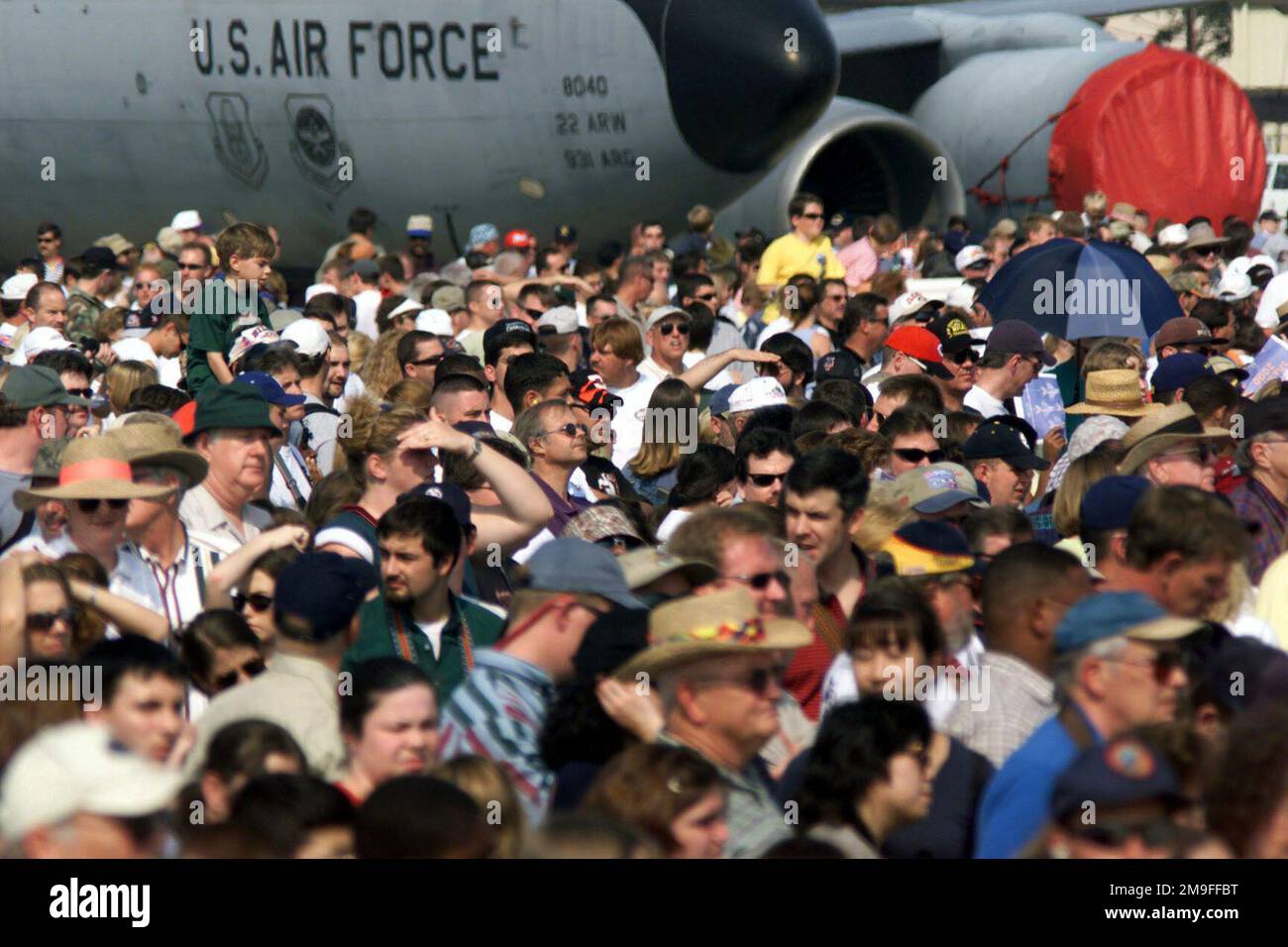 Thousands of spectators crowd the fence near the U.S. Air Force ...