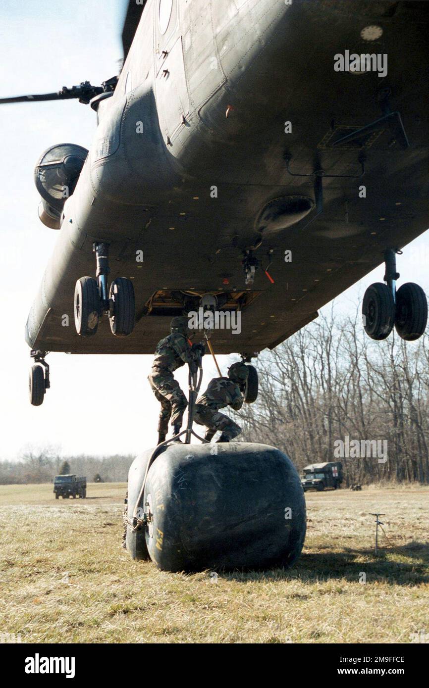 Soldiers from the 426TH Forward Support Battalion hook up 500 gallon ...