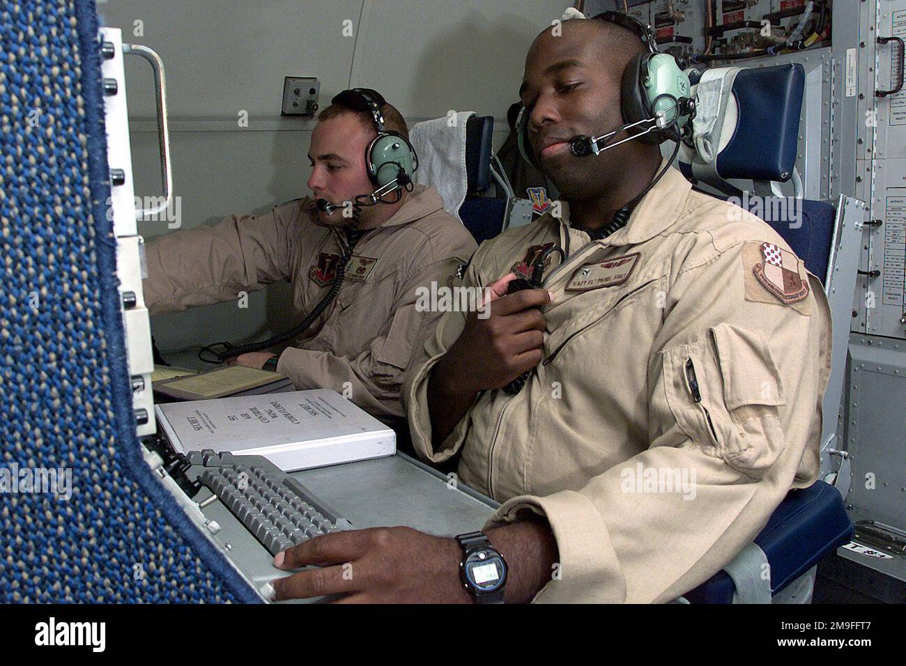 US Air Force STAFF Sergeant Elliott Paige (Foreground) a Computer ...