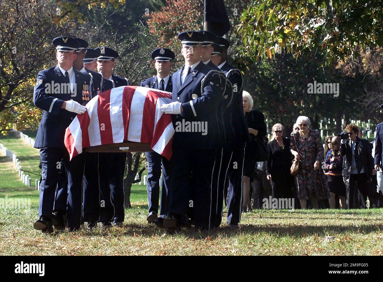 US Air Force members hold a flag draped coffin during a full honor ...