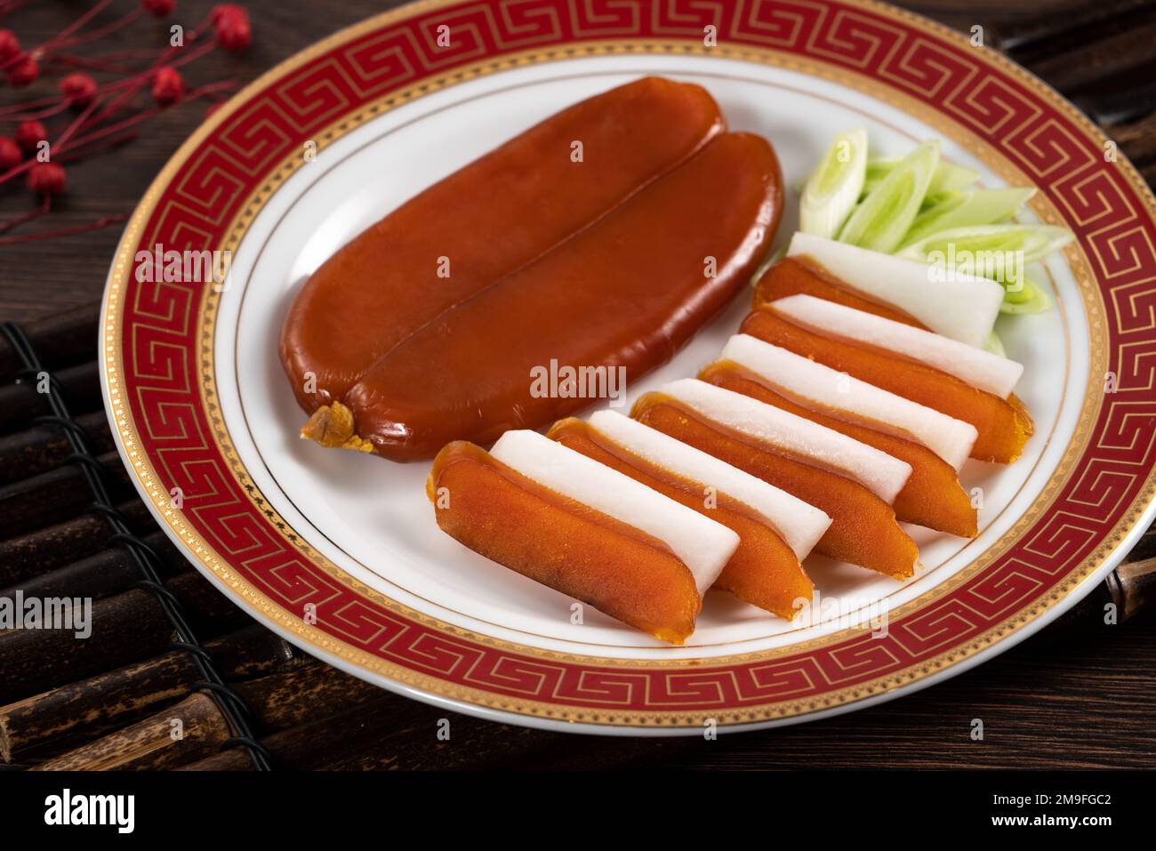 Delicious fresh mullet roe with white radish slices and garlic sprout ...