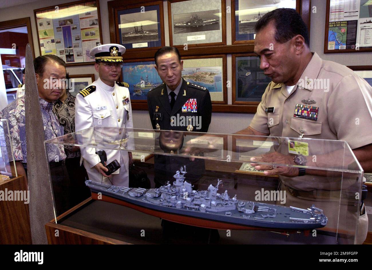 US Navy MASTER CHIEF PETTY Officer Felise Tupola (Right) shows a model ...