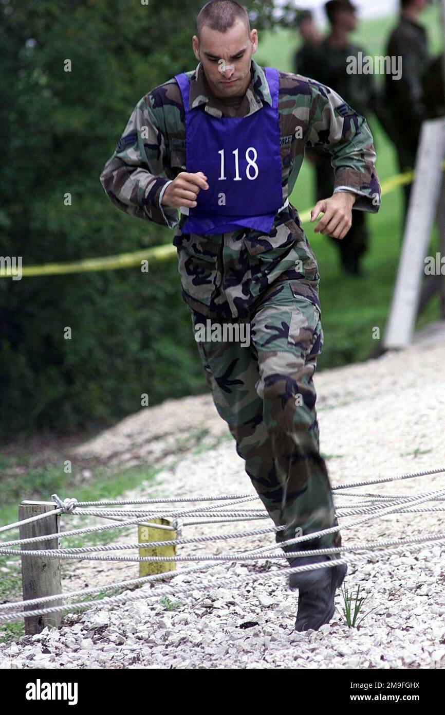US Air Force SENIOR AIRMAN Seth Arthur runs through the"Tangle Foot ...