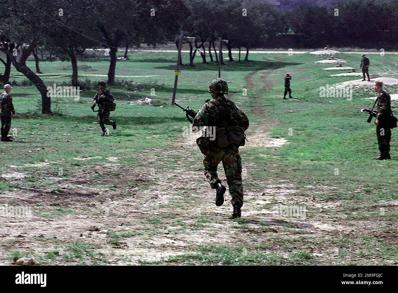 British Forces Corporal Mark Holyday (Center), a team member ...