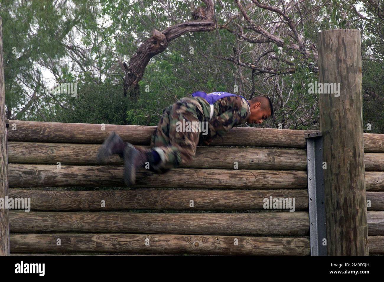 A DEFENDER CHALLENGE 2000 competitor makes his way over an obstacle at ...