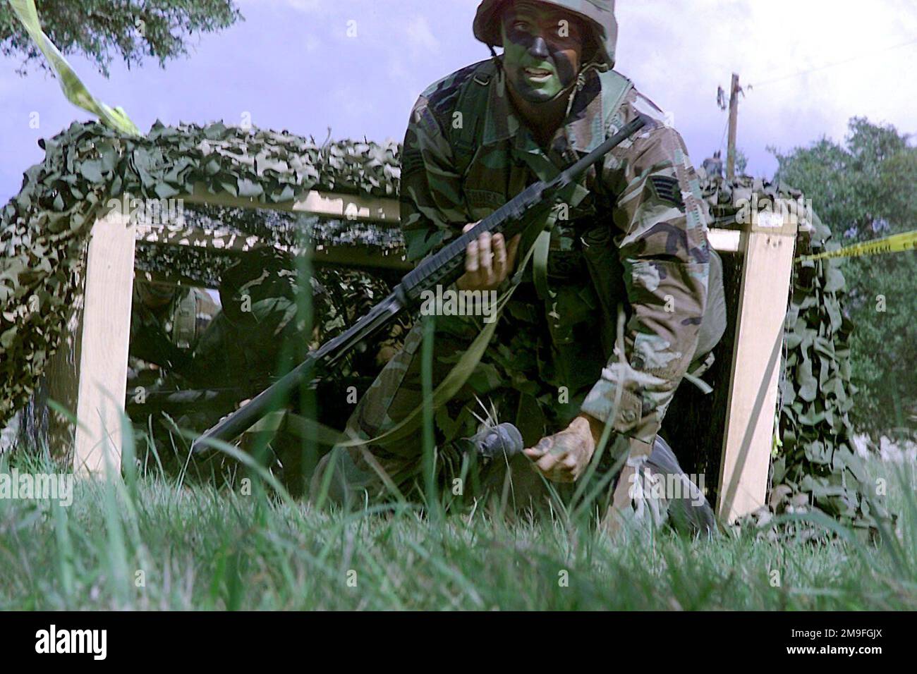 US Air Force STAFF Sergeant Guy Dashnea emerges from the low crawl ...
