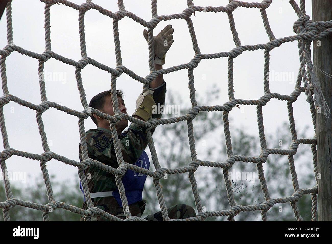 US Air Force STAFF Sergeant Timothy Kane scales the rope ladder of the ...