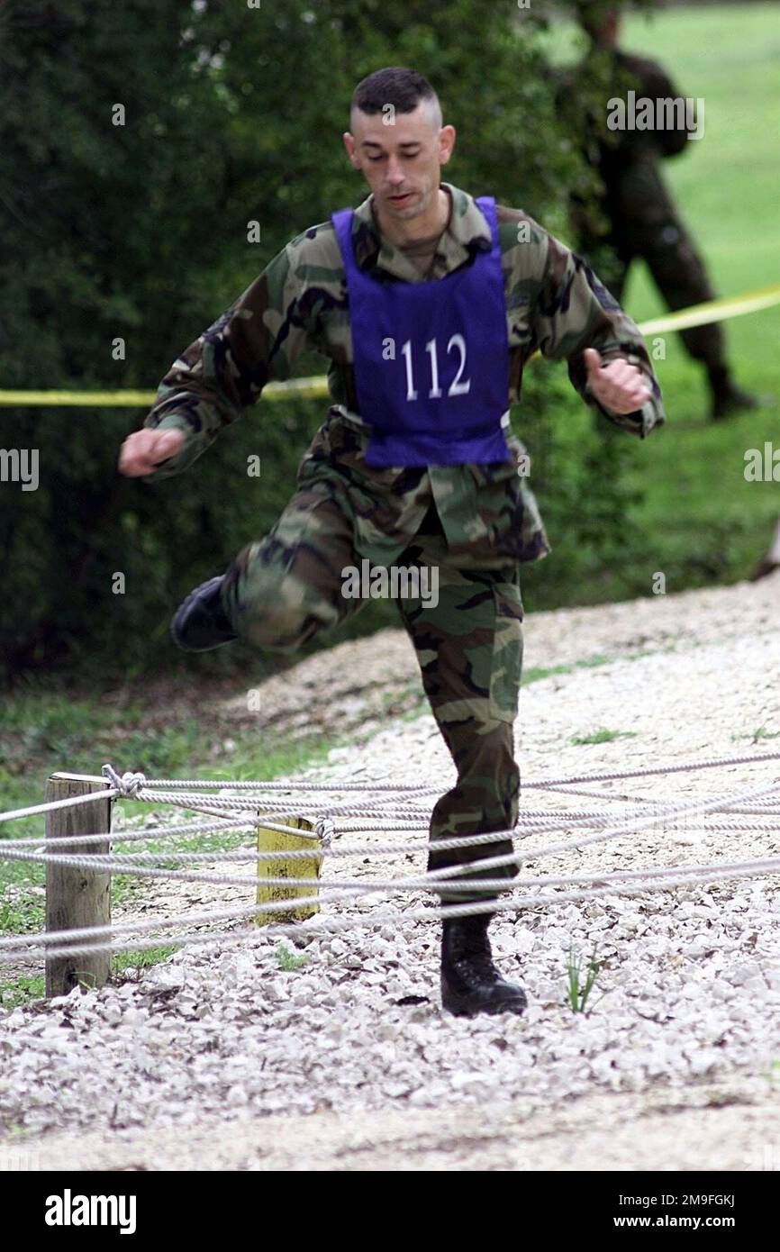 US Air Force STAFF Sergeant Steven R. Fox runs through the "Tangle Foot ...