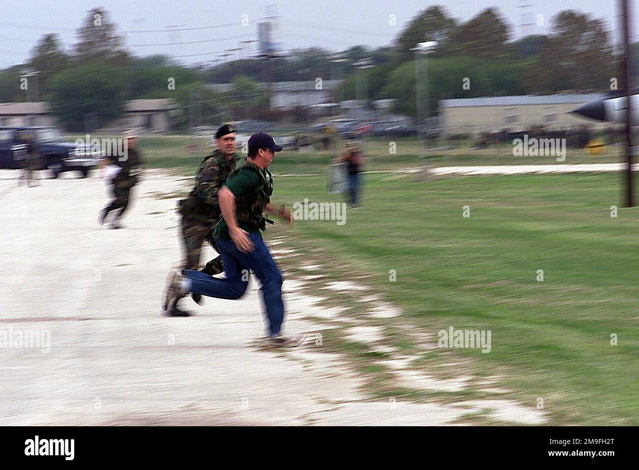 Air Force Reserve Command security forces chases an infiltrator during ...