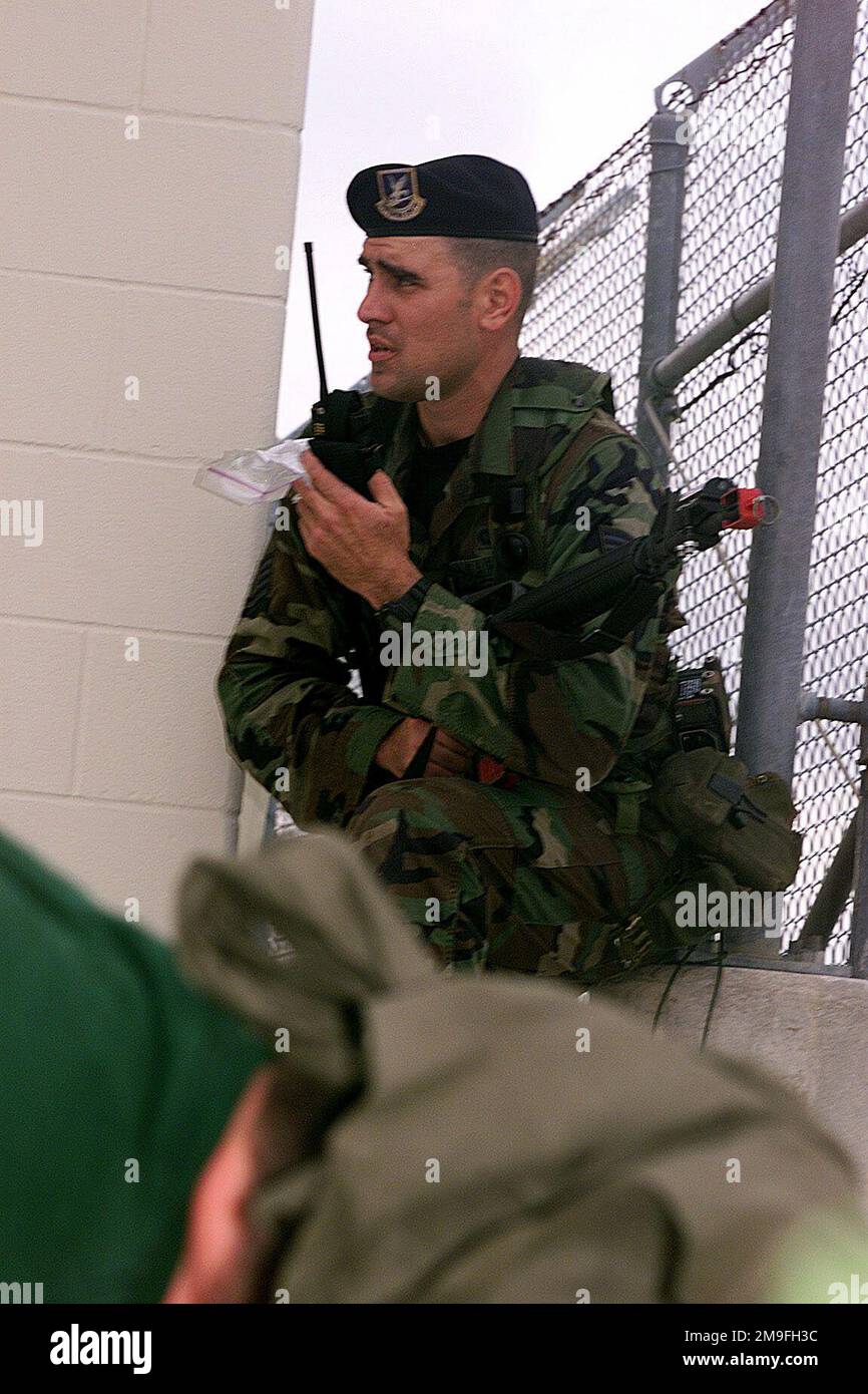 US Air Force STAFF Sergeant Wayne M. Hall communicates with team ...
