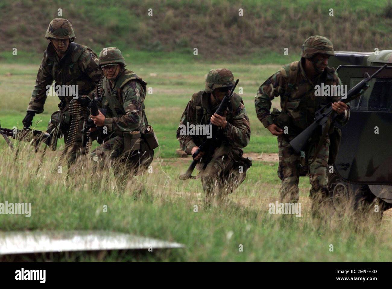 Moving to their positions to fire their M16A2 rifles down range are Air ...