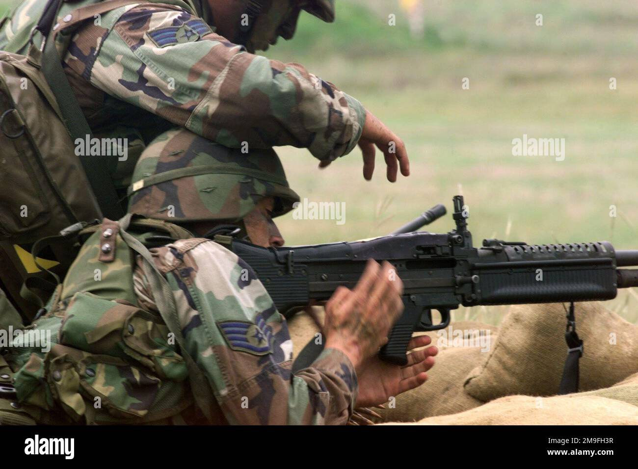 US Air National Guard SENIOR AIRMAN Andrew Moya assists his teammate ...