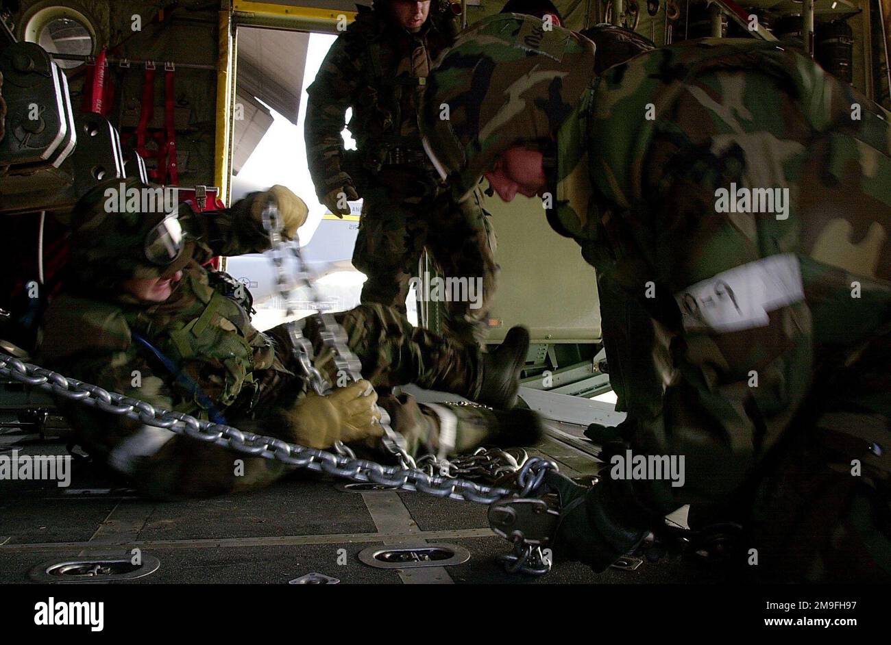 A loadmaster from the 136th Airlift Wing (AW), Fort Worth, Texas ...