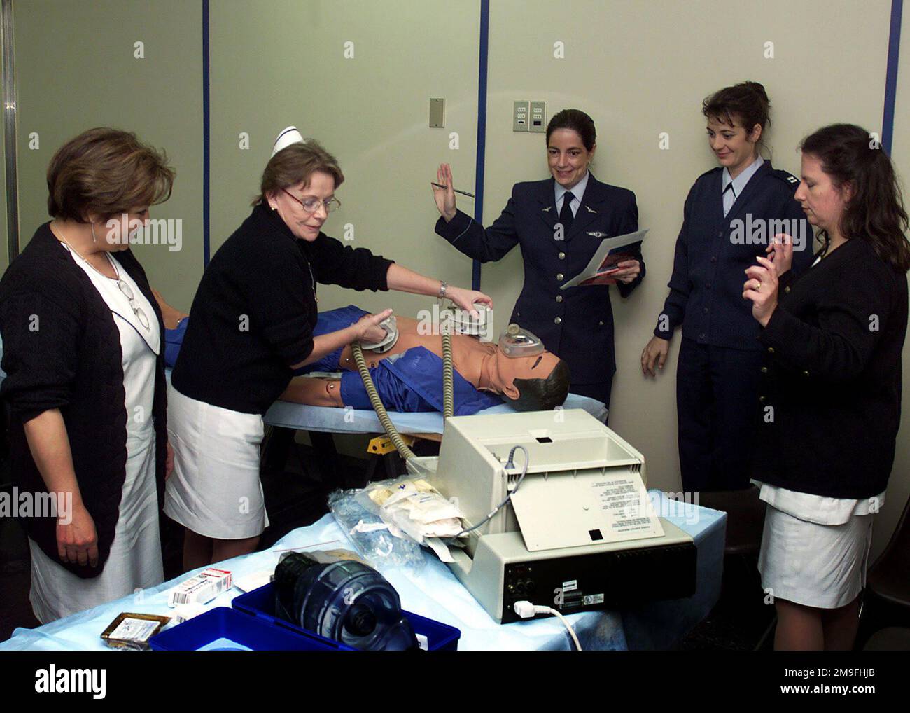 Cristina Briones Robertson (2nd from left) demonstrates cardiac ...