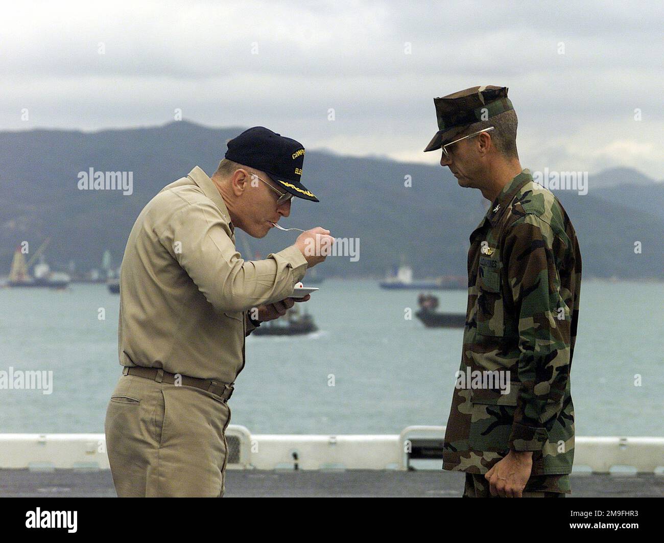 US Navy Captain (CAPT) F. Lee Touchberry, watches carefully as US ...