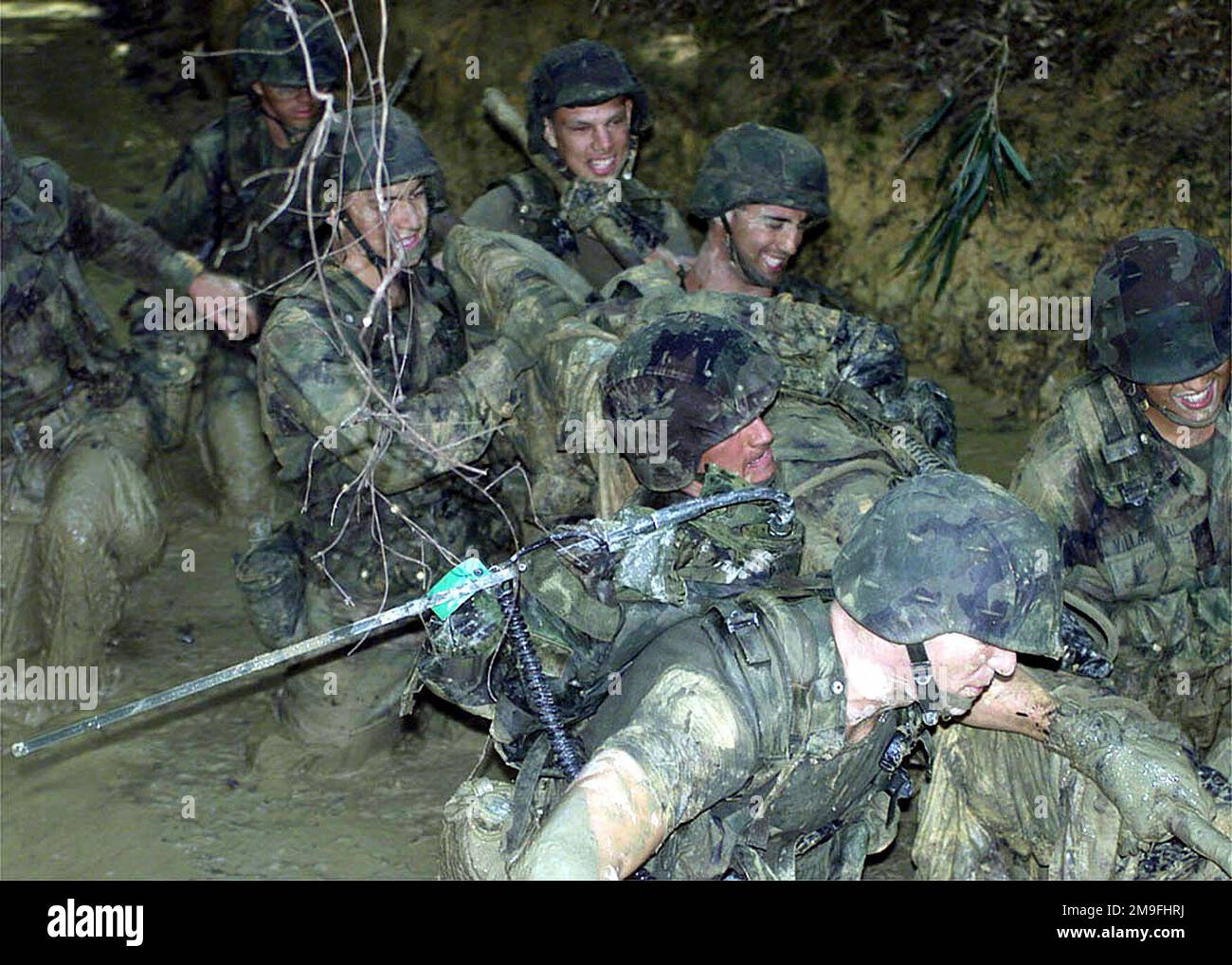 US Marines from the 3D Marine Division Communication Company, carry ...