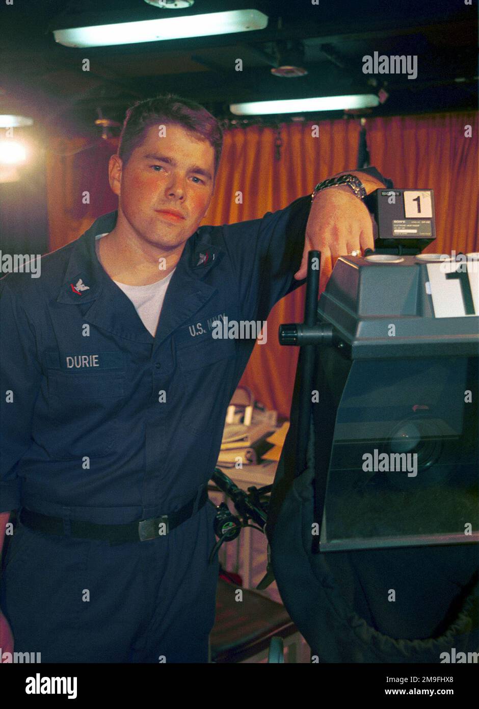 US Navy Journalist Third Class Eric Durie poses by a video camera in ...