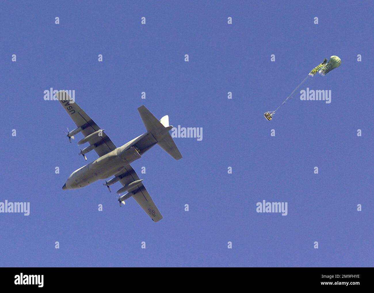 A California Air National Guard C-130E Hercules air- drops medical ...