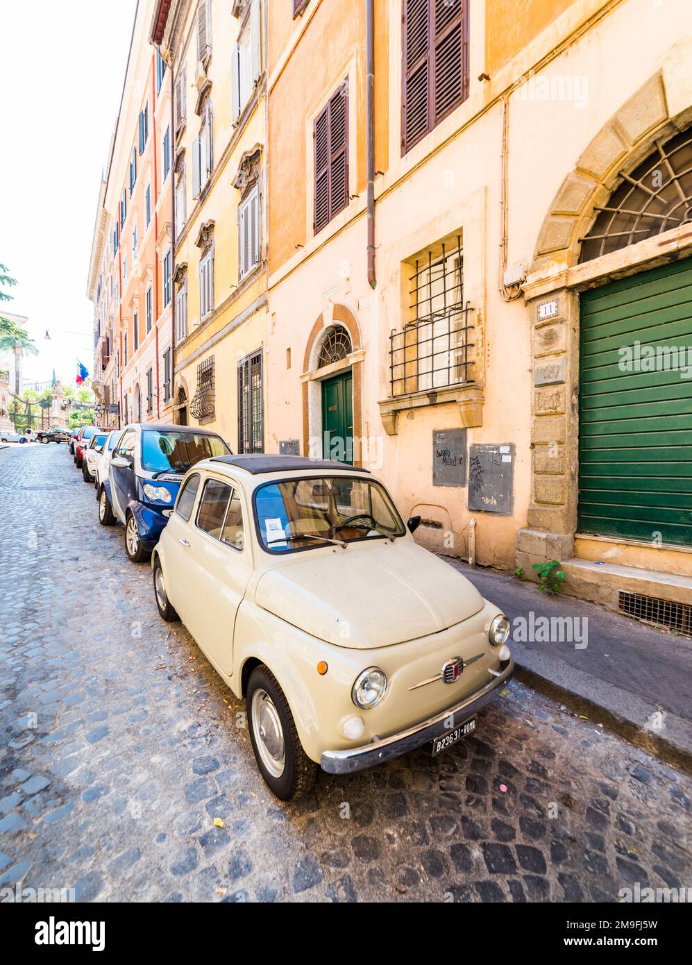 ROME, ITALY - JUNE 30, 2019: Small vintage car on beautiful street in ...