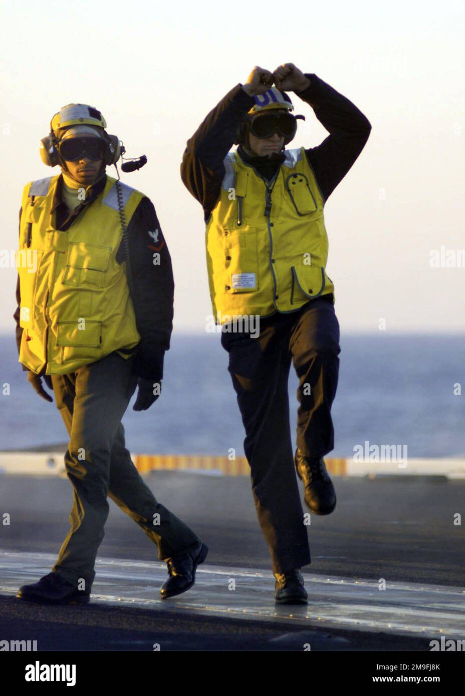 US Navy AIRMAN Dwain Willis and US Navy Aviation Boatswain Mate Handler ...