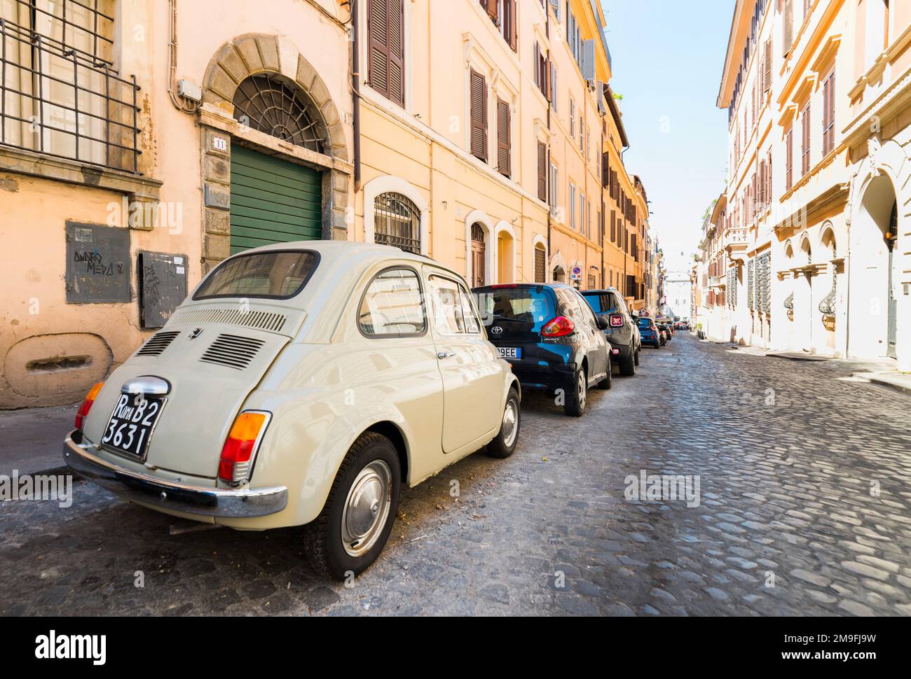 ROME, ITALY - JUNE 30, 2019: Small vintage car on beautiful street in ...